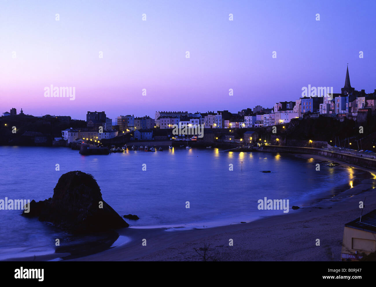 Tenby harbour and North Beach at night Pembrokeshire West Wales UK ...