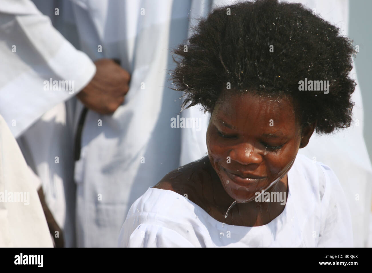 A woman being baptized in Africa Stock Photo - Alamy