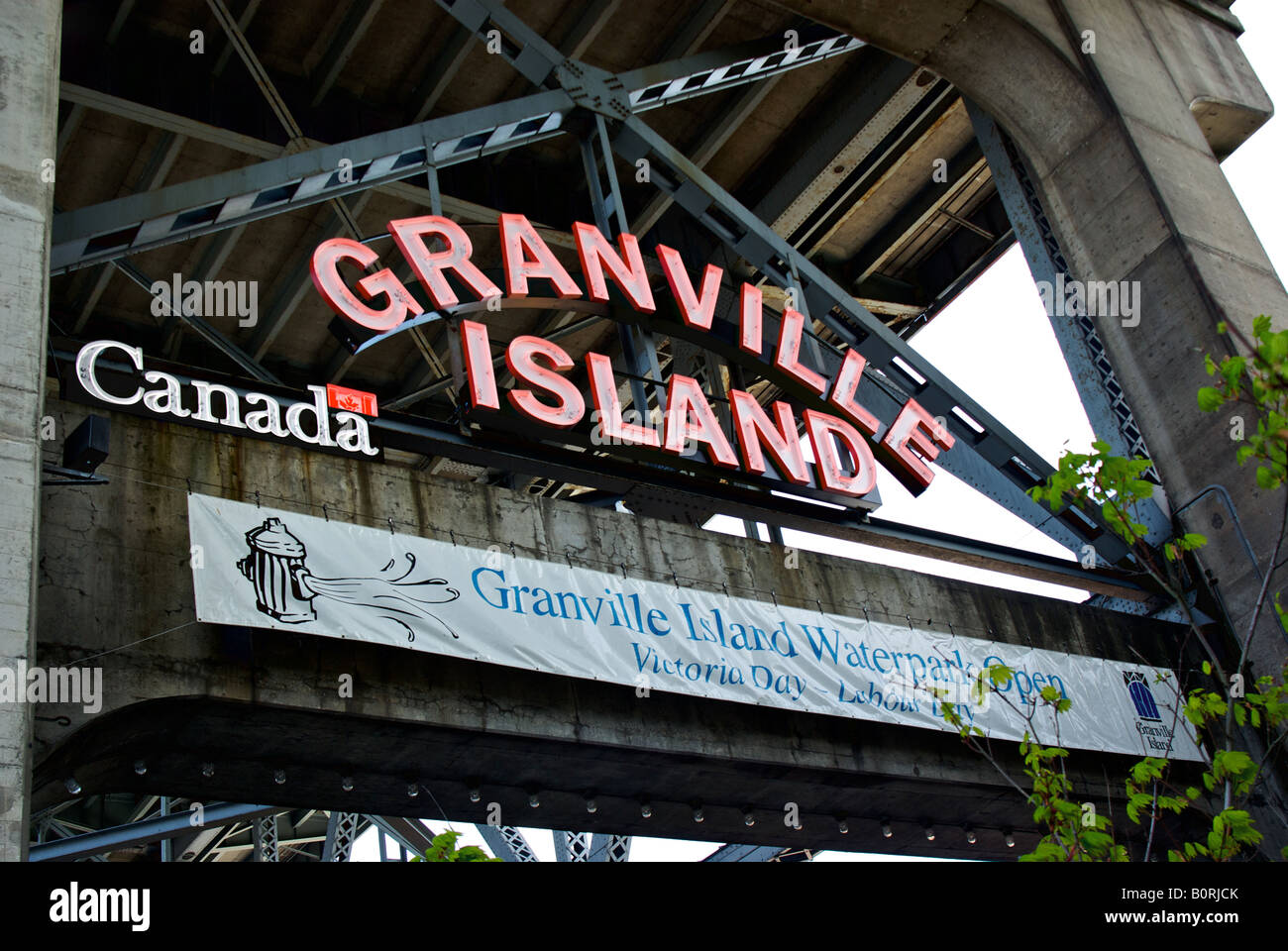 Granville Island neon sign under the Bridge Stock Photo - Alamy