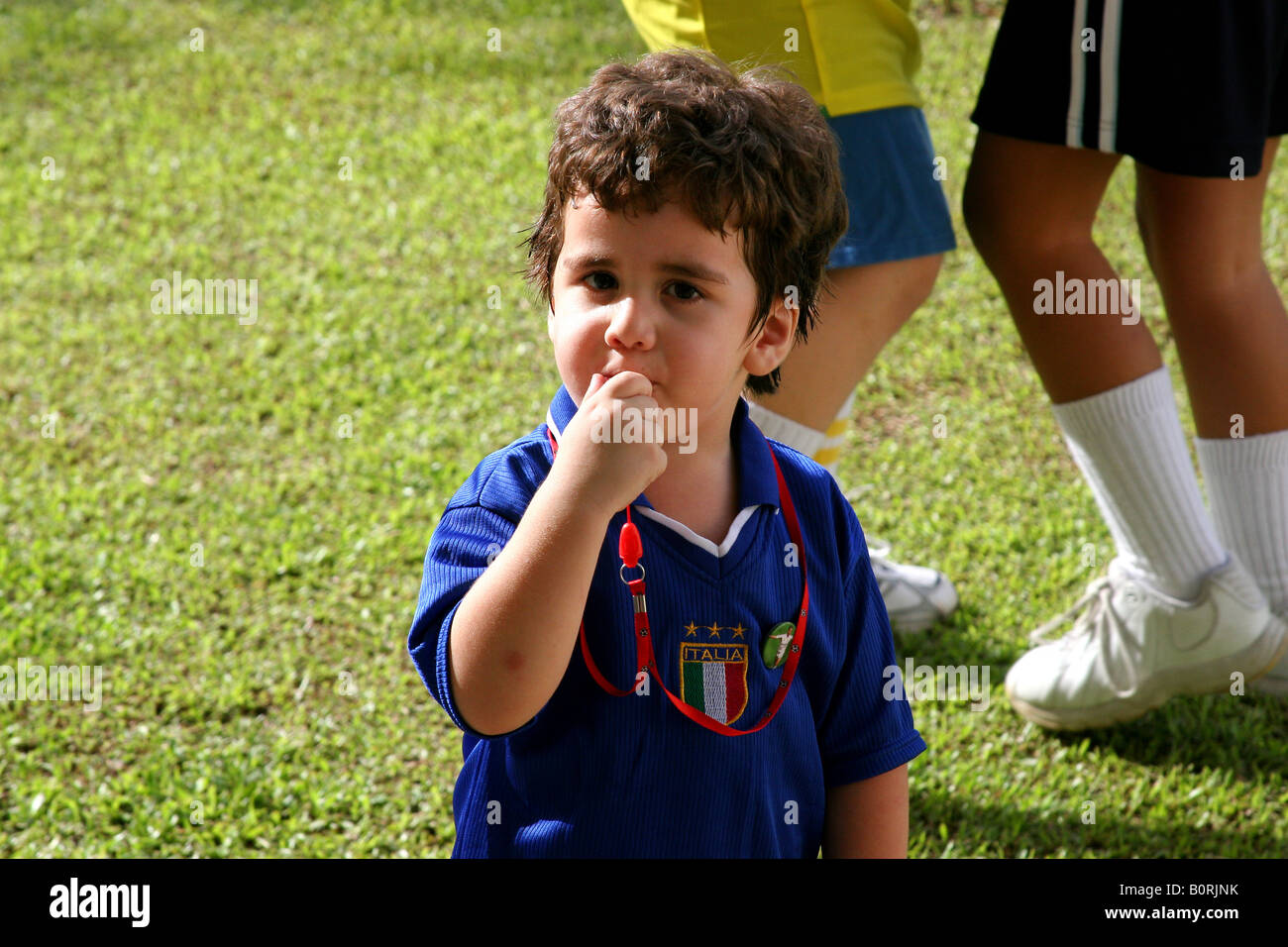 Small boy playing as a soccer referee Stock Photo - Alamy