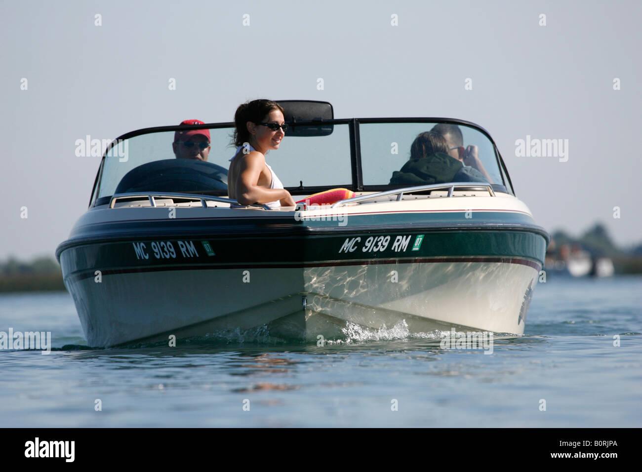 Water level view of an approaching boat Stock Photo - Alamy