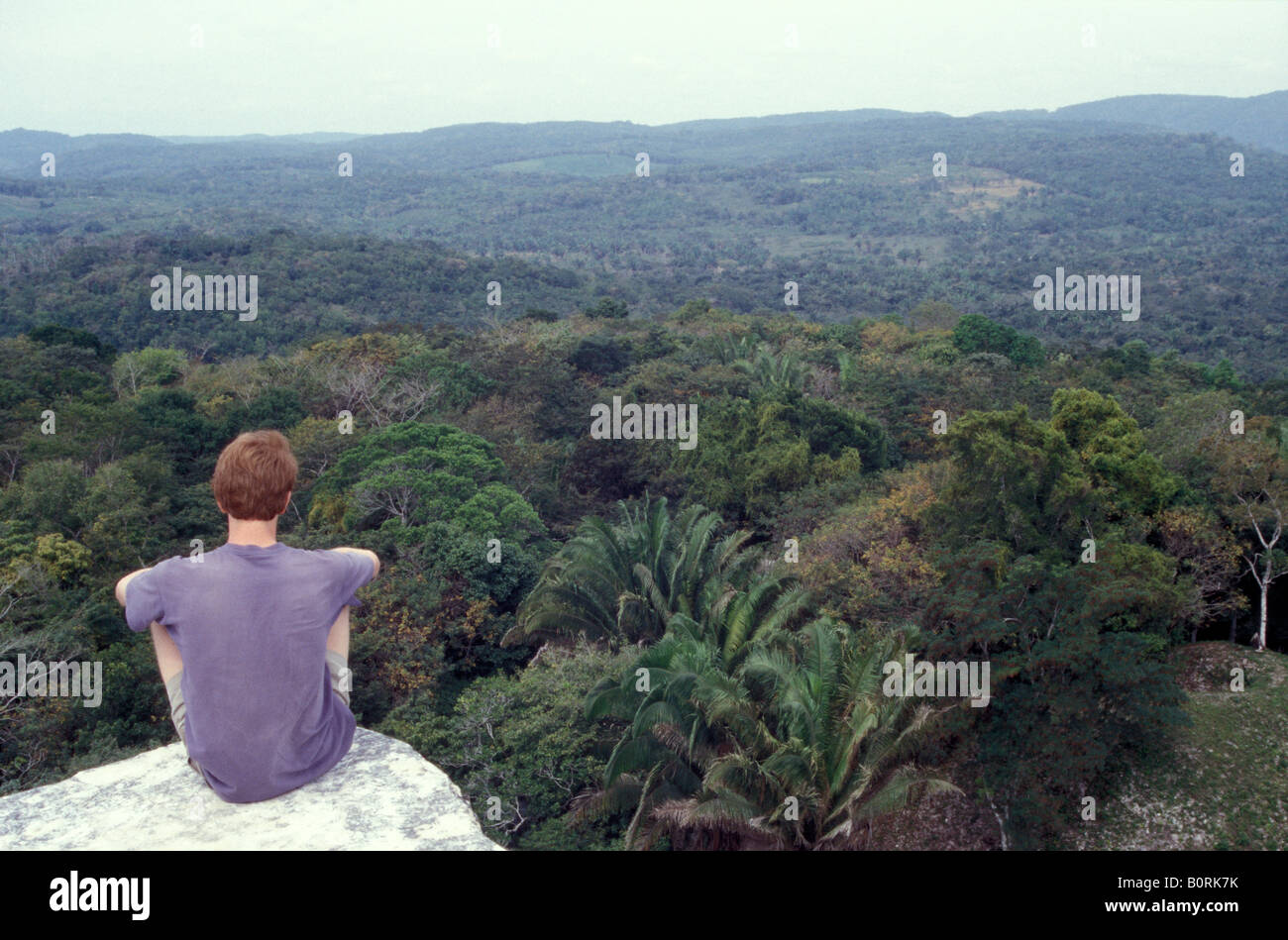 Tourist enjoying the view of the jungle from the top of El Castillo at ...