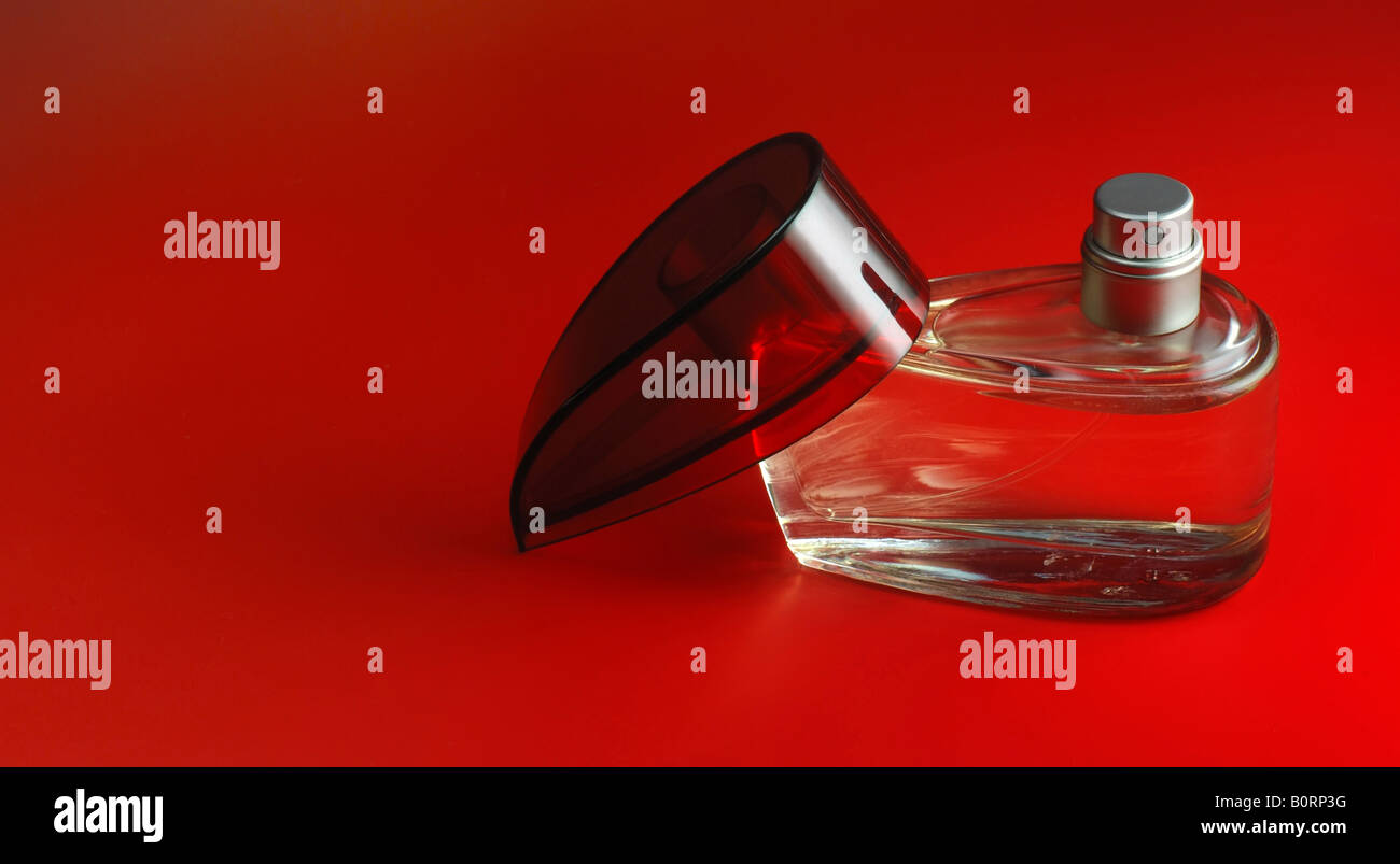 perfume A bottle perfume on a red background with effective ...