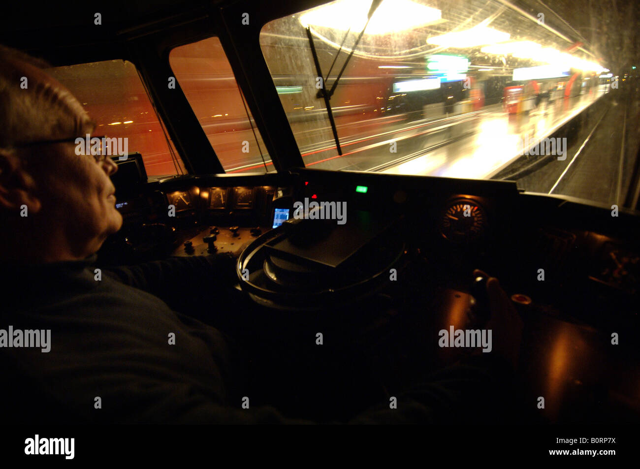 Train Engine driver entering a train station Stock Photo - Alamy
