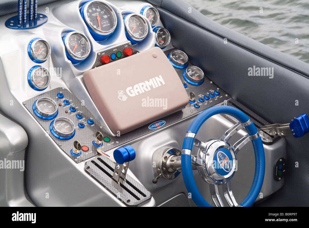 speedboat cockpit wheel gauges garmin gps sat nav Stock Photo - Alamy