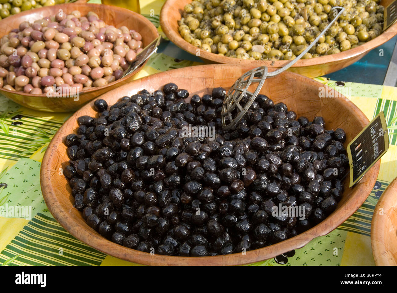 fresh olives on market stall in french food black green variety ...