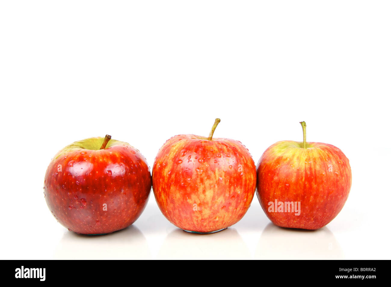 Red apples isolated against a white background Stock Photo - Alamy
