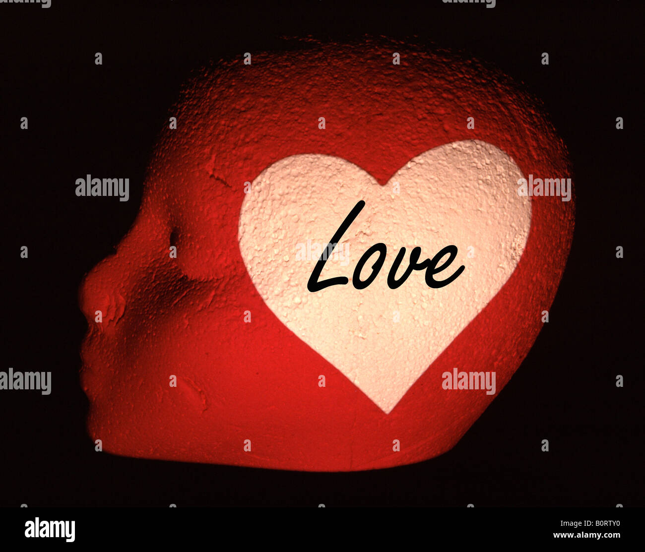 Heart shape projected onto dummy head Stock Photo - Alamy