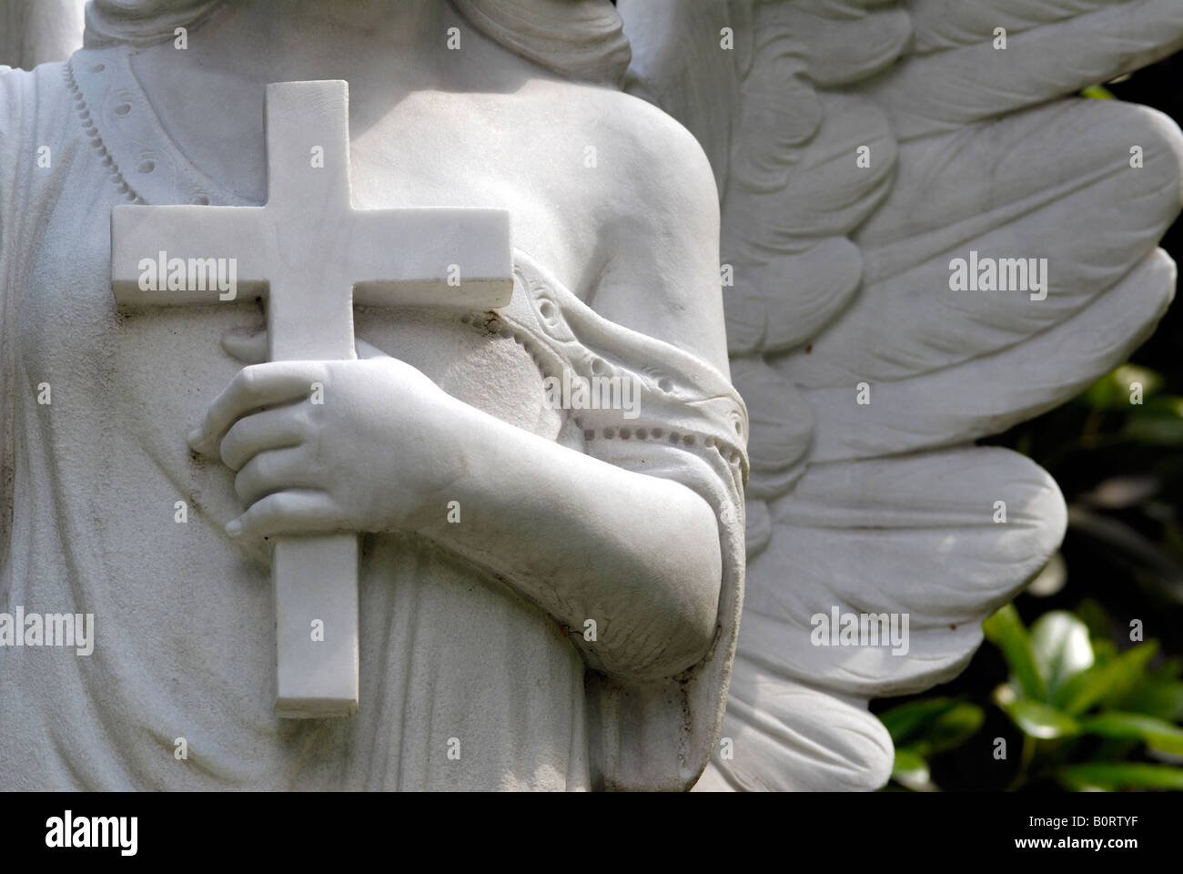 Angel with cross Stock Photo - Alamy