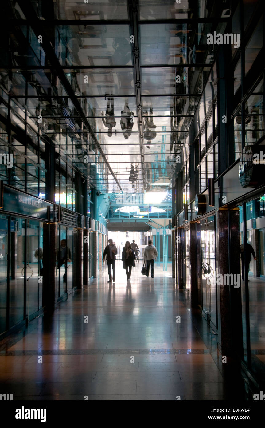 People walk through Kaufingertor glass-roofed passage which connects ...