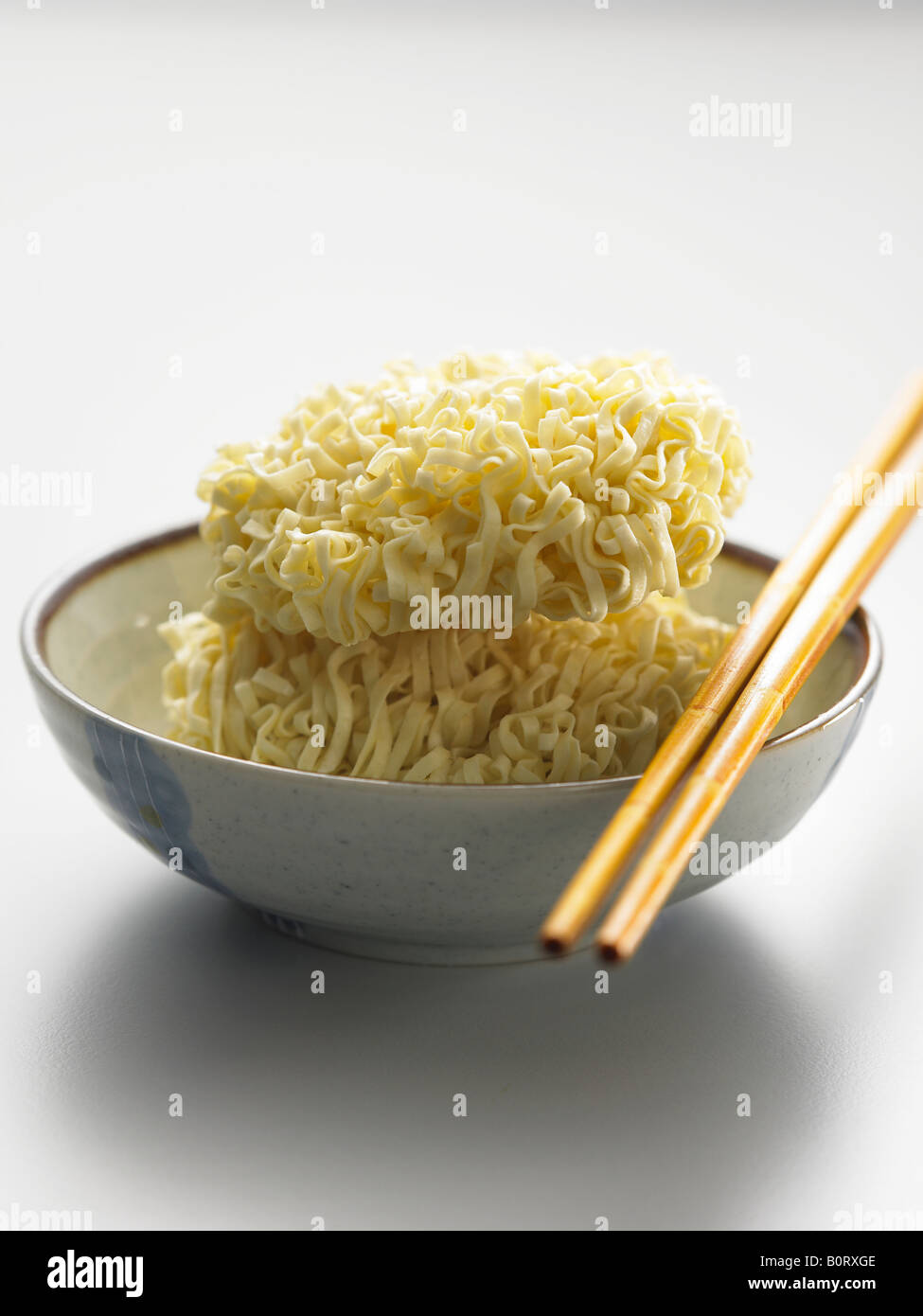 dried noodle in a bowl with chopstick Stock Photo - Alamy