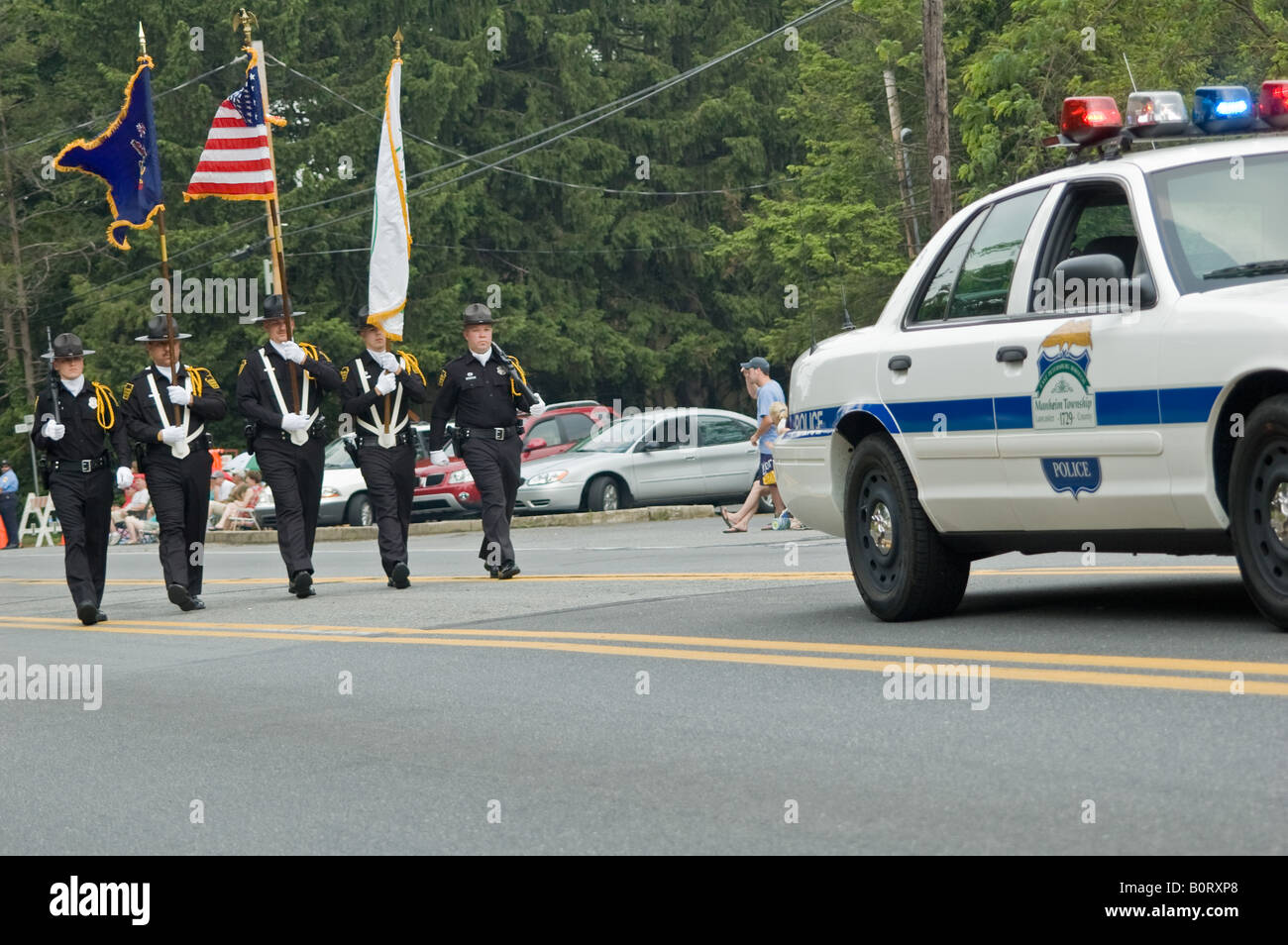 Police department color guard leads small town patriotic parade Stock ...