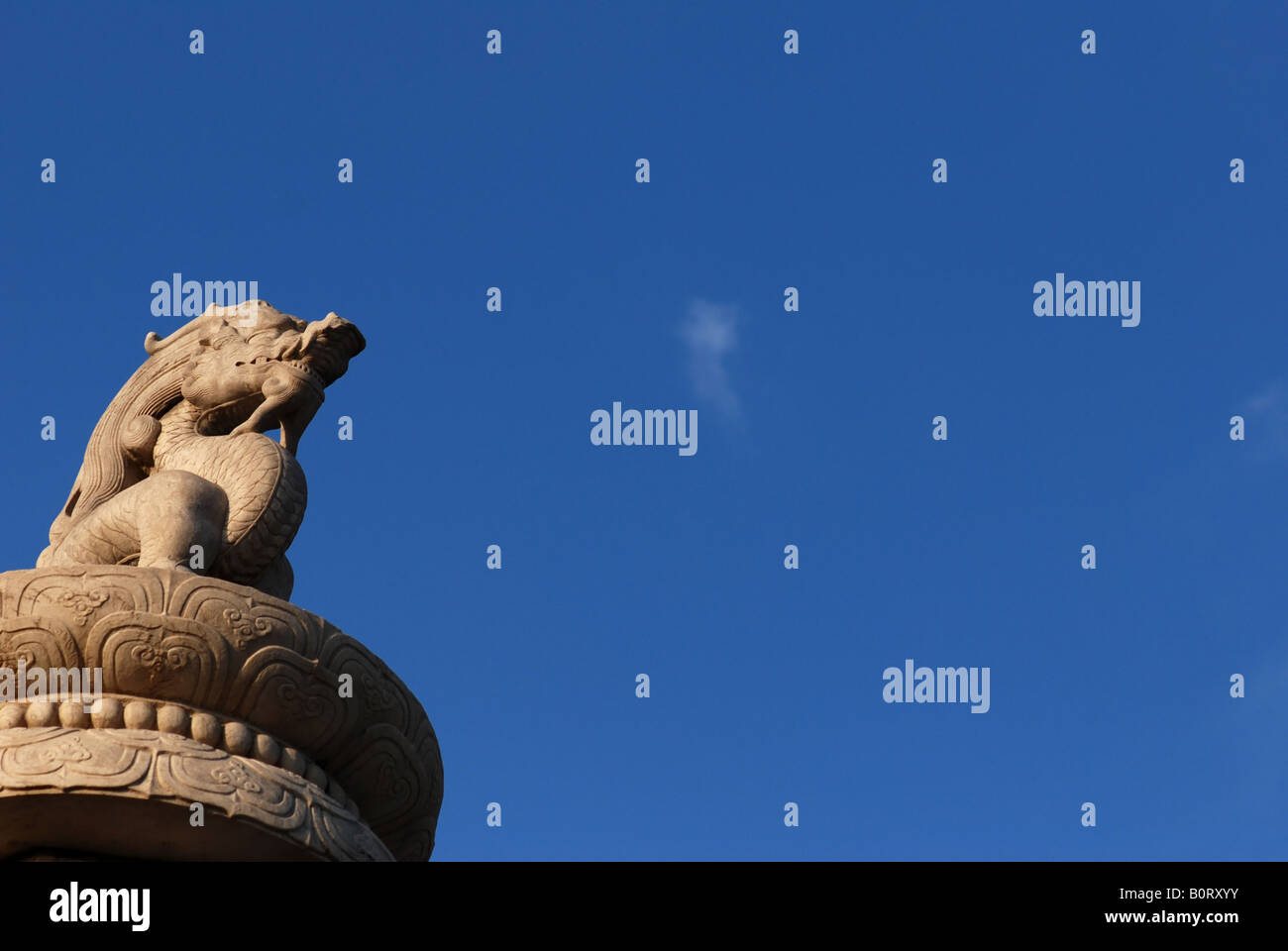 Chinese totem pillar under the blue sky Stock Photo - Alamy