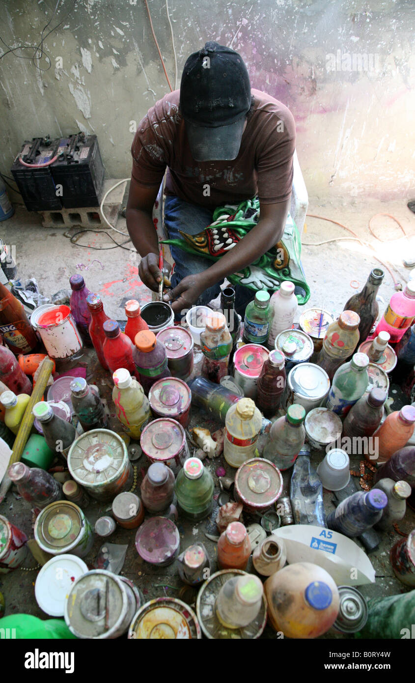 Dominican maskmaker in his workshop prepares carnival masks Diablo ...