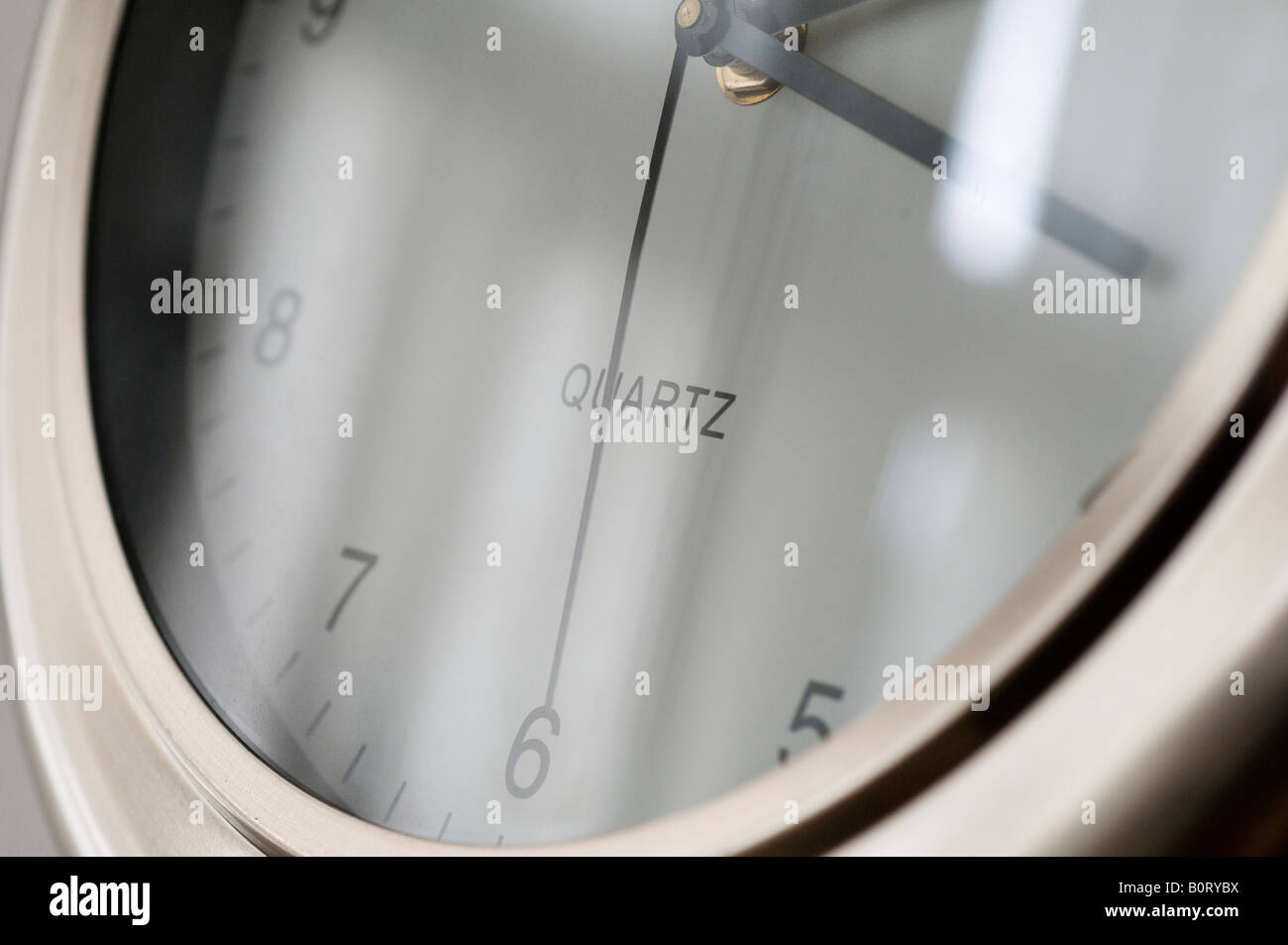 Close up of a modern quartz wall clock Stock Photo - Alamy