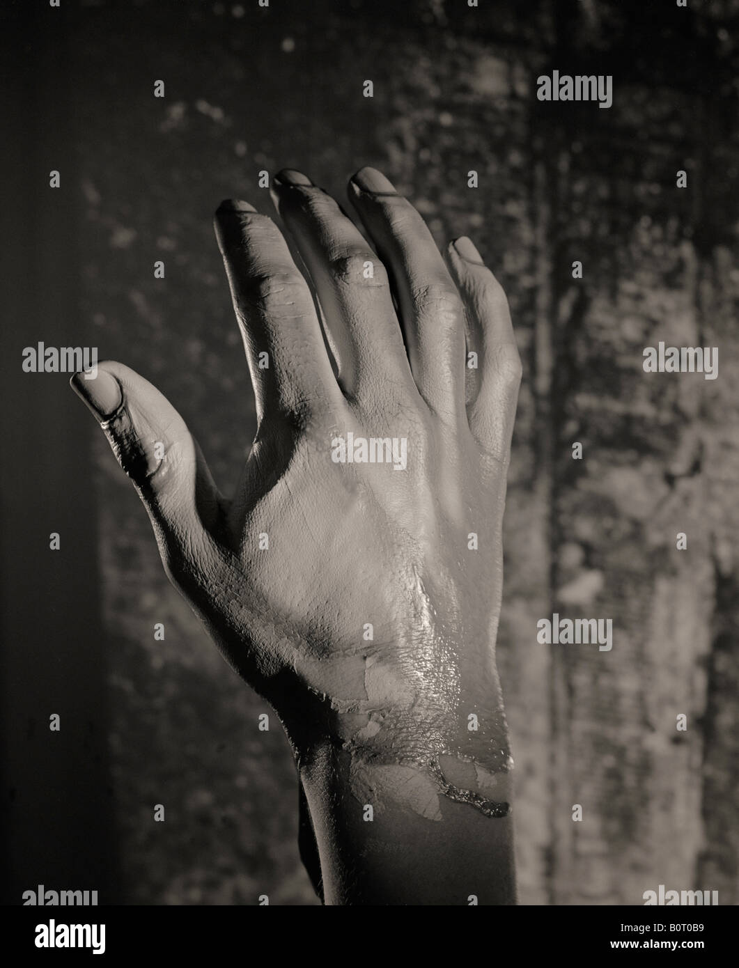 muddy hand reaching up Stock Photo - Alamy