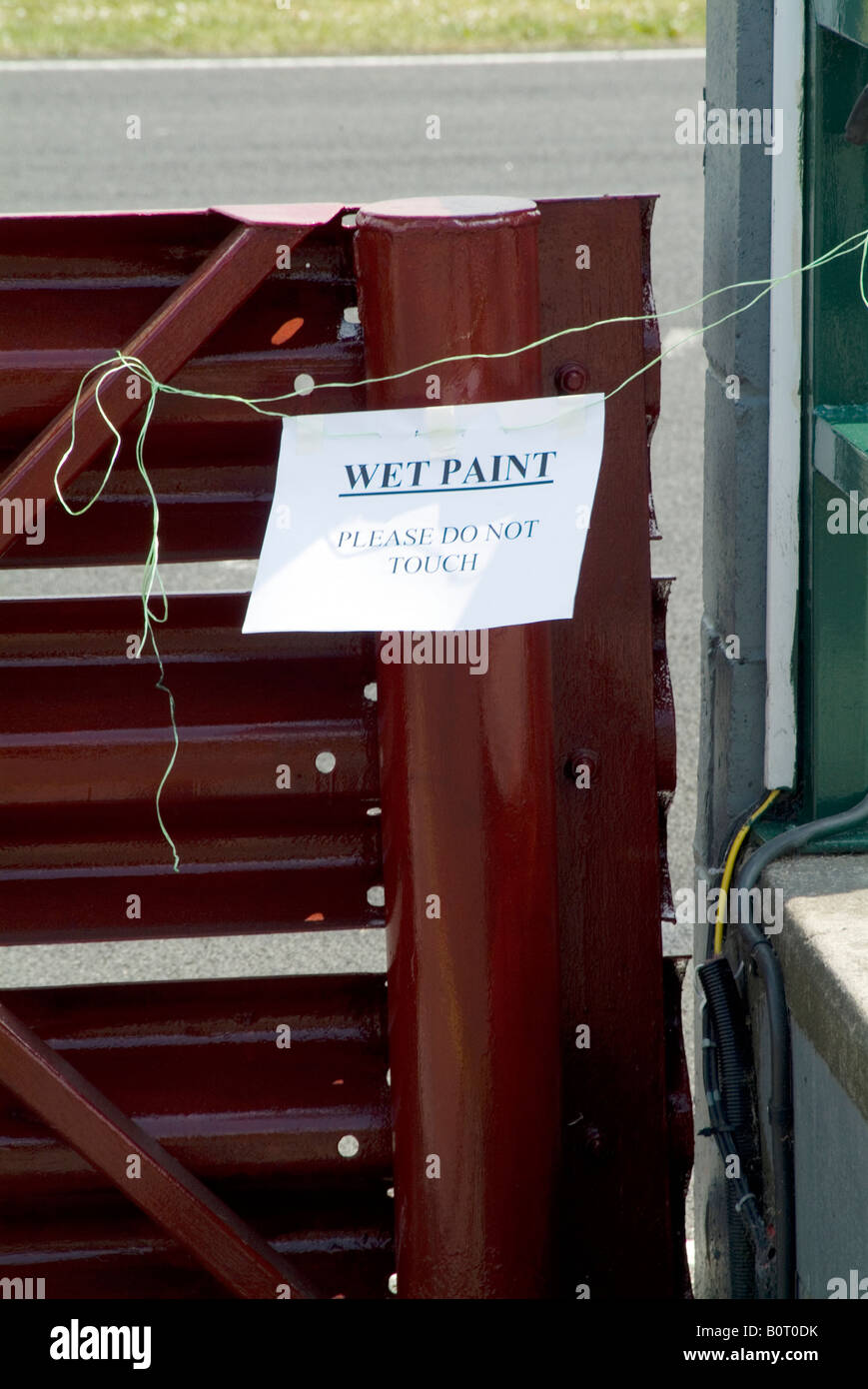 wet paint sign on freshly painted gate damp sticky warning Stock Photo ...