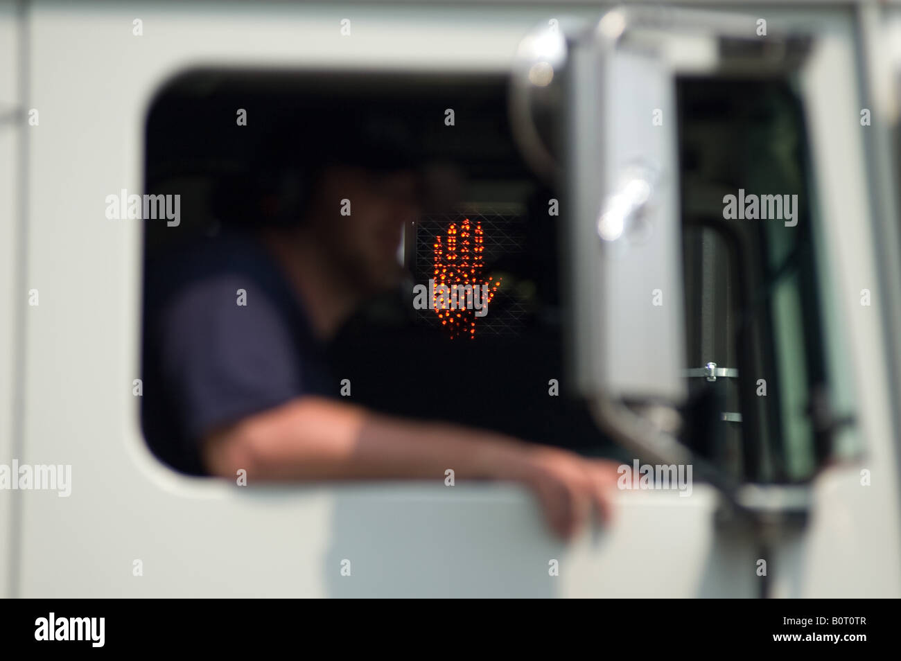 traffric signal hand warning fireman in truck cab Stock Photo - Alamy