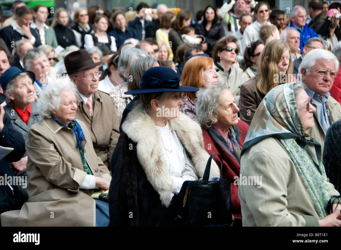 Germans attending an outdoor Catholic mass in Marienplatz, town hall ...