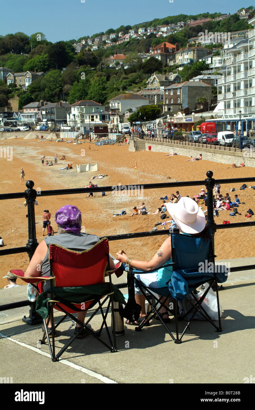 Tourists sitting on Ventnor seafront Isle of Wight England ventnor is a ...
