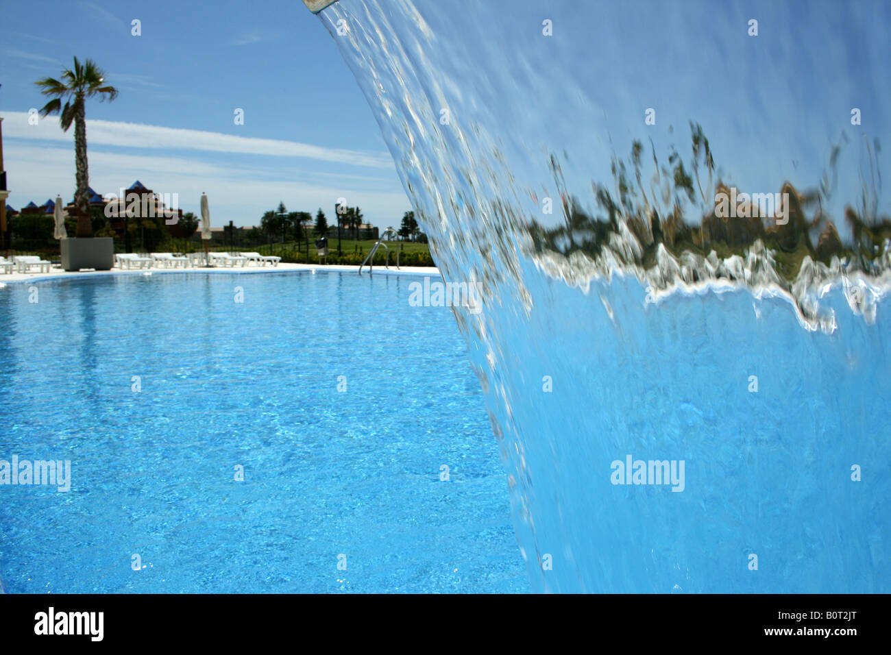 water cascade from poolside fountain Stock Photo - Alamy
