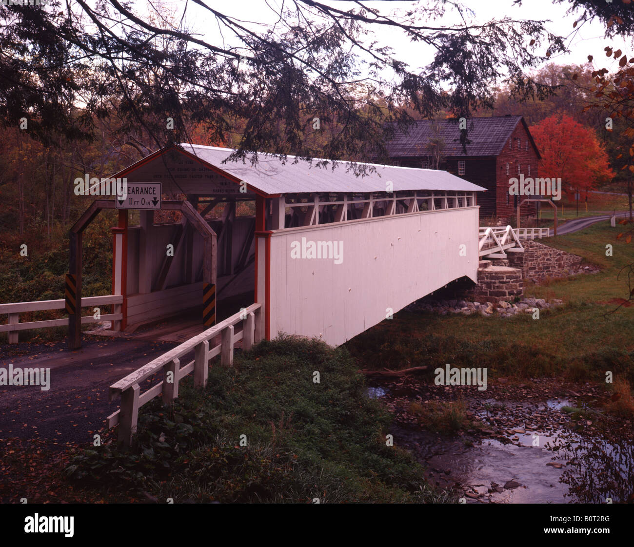 Covered Bridge over Stream Stock Photo - Alamy