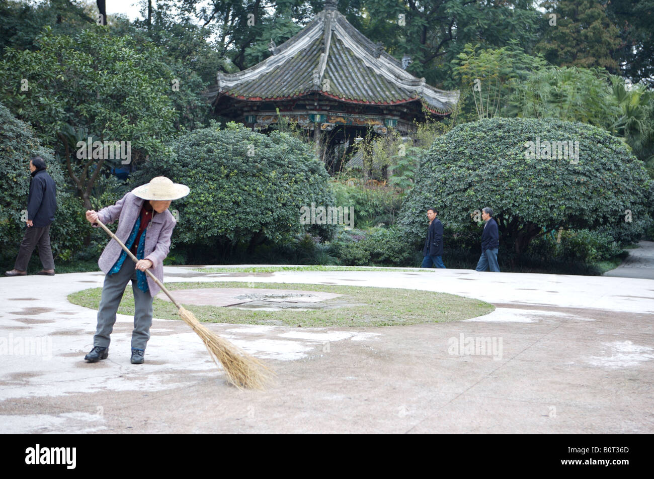 Woman Sweeping in a park in Chengdu Stock Photo - Alamy