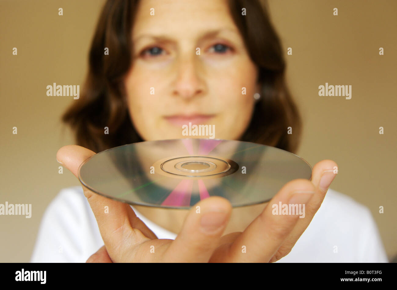 Woman holding disc Stock Photo - Alamy