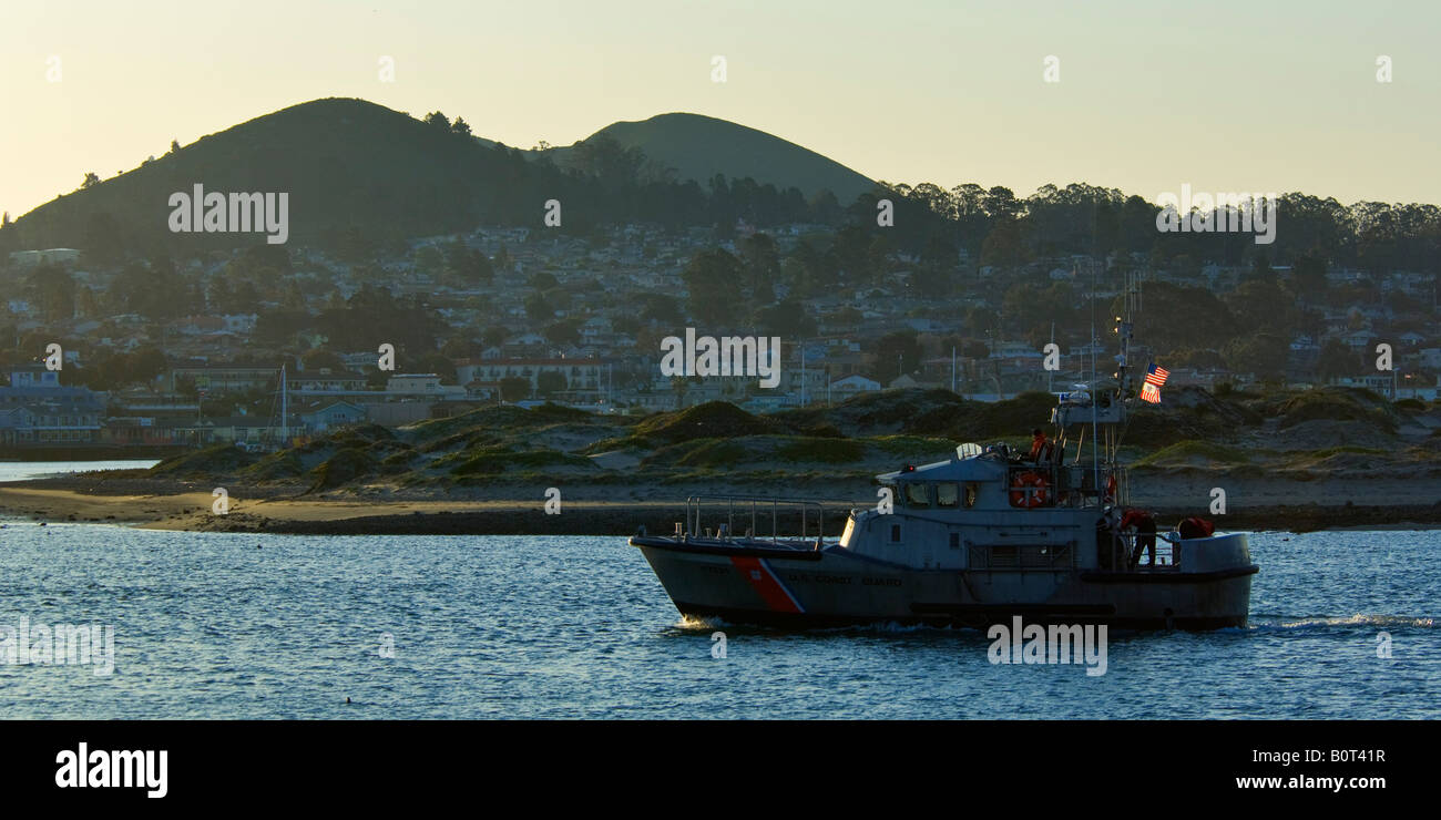 Coast Guard 47 foot Motor Life boat returning to harbor at sunrise ...