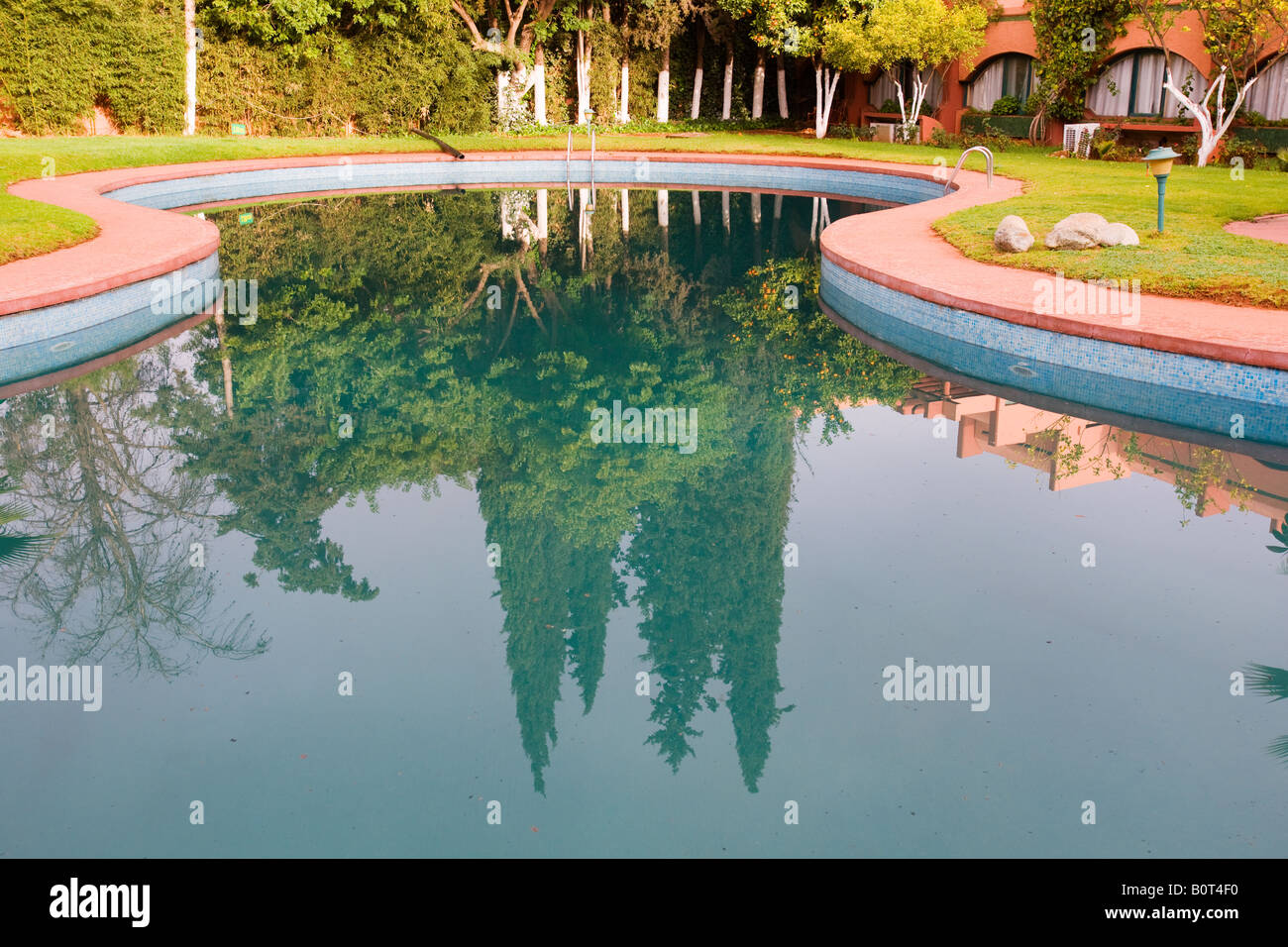 Swimming pool with reflection in back yard Focus on reflection Stock ...