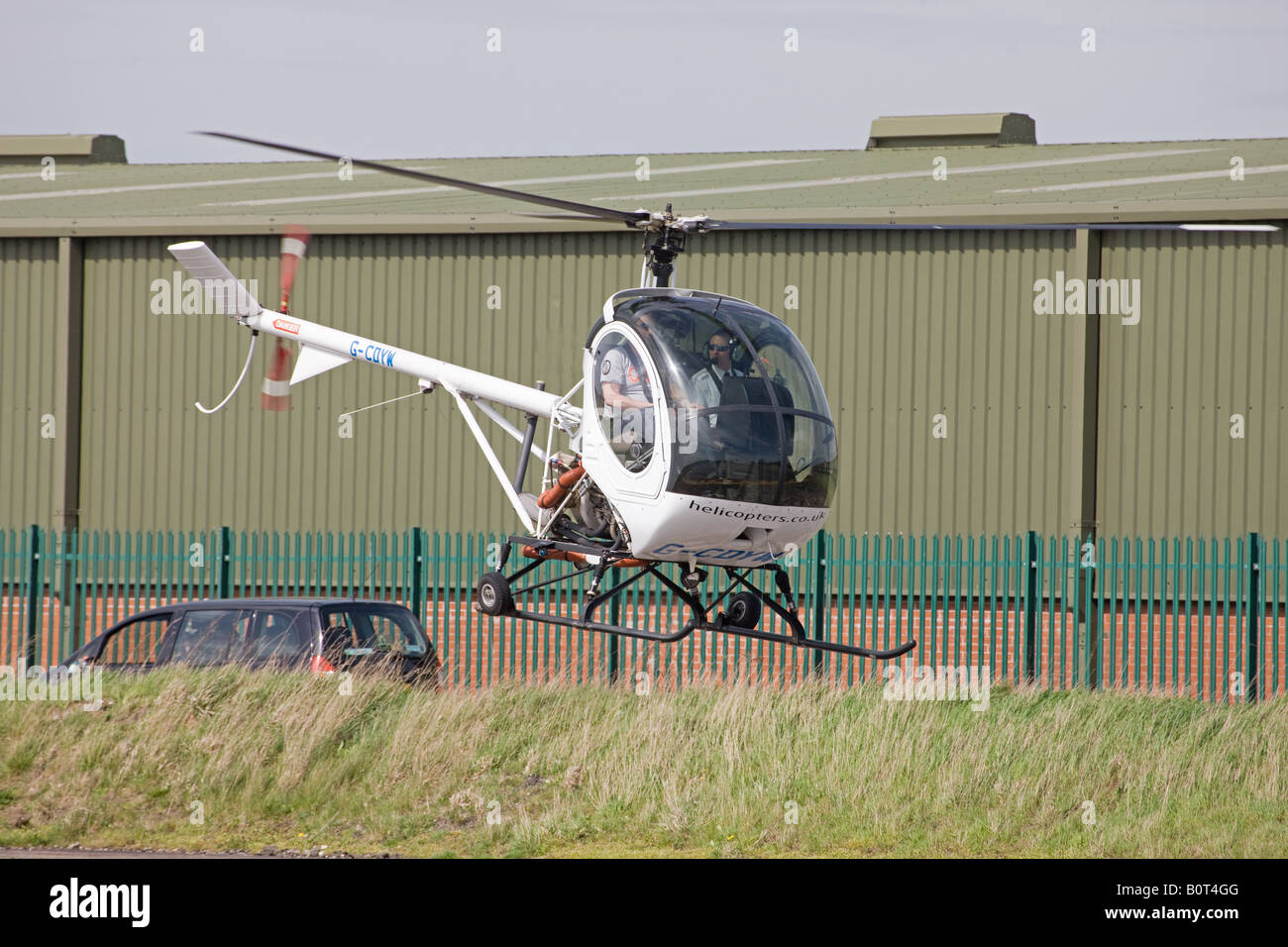 Schweizer 269C-1 G-CDYW helicopter in flight at Sandtoft Airfield Stock ...