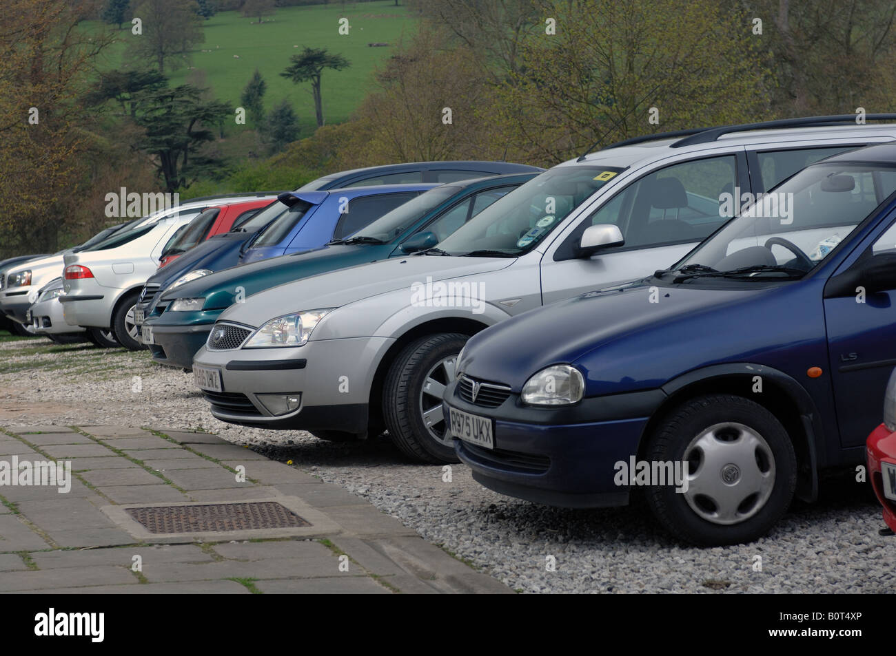 Cars parked in a field Stock Photo - Alamy