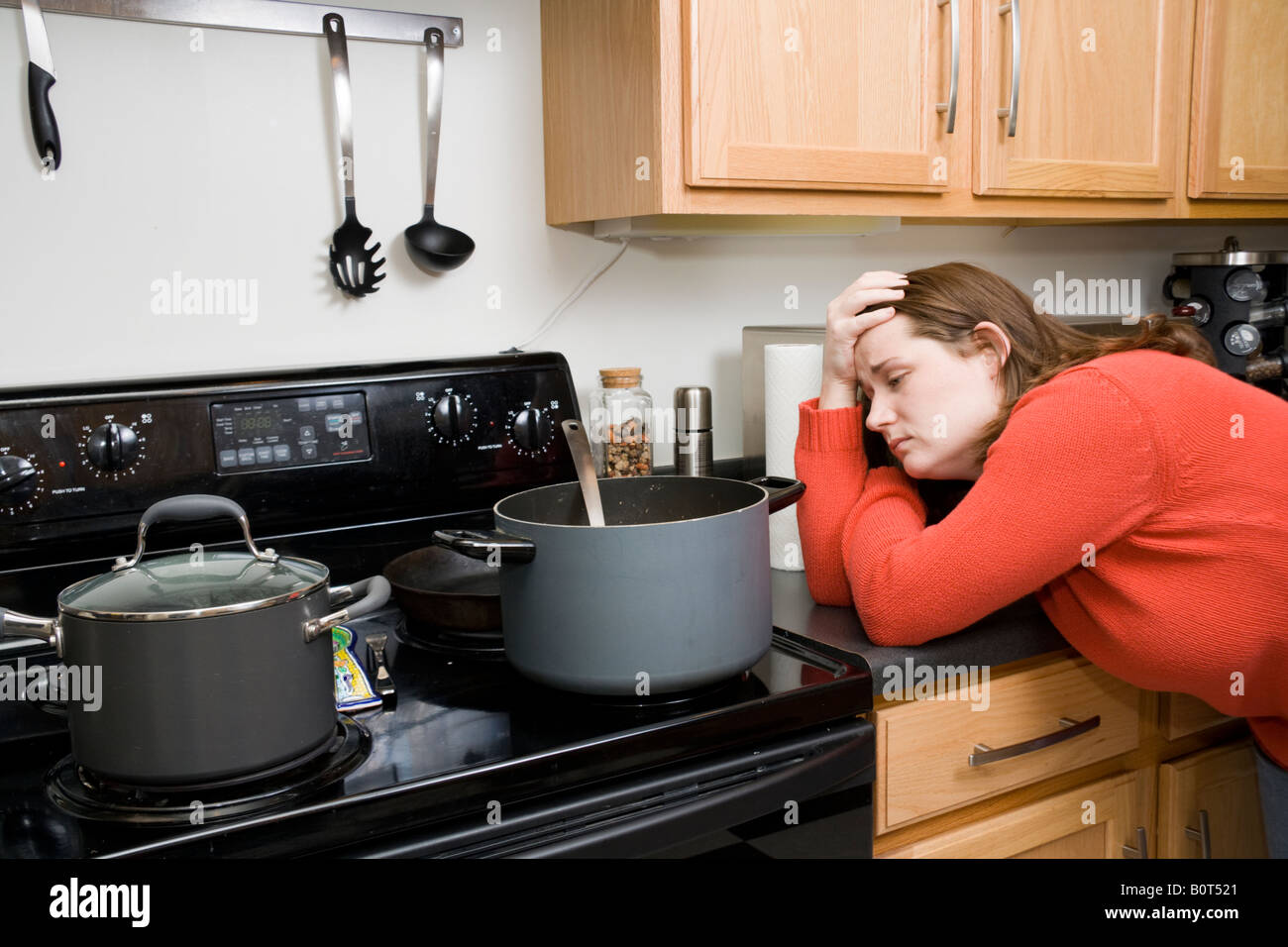 Woman cooking pot frustration hi-res stock photography and images - Alamy