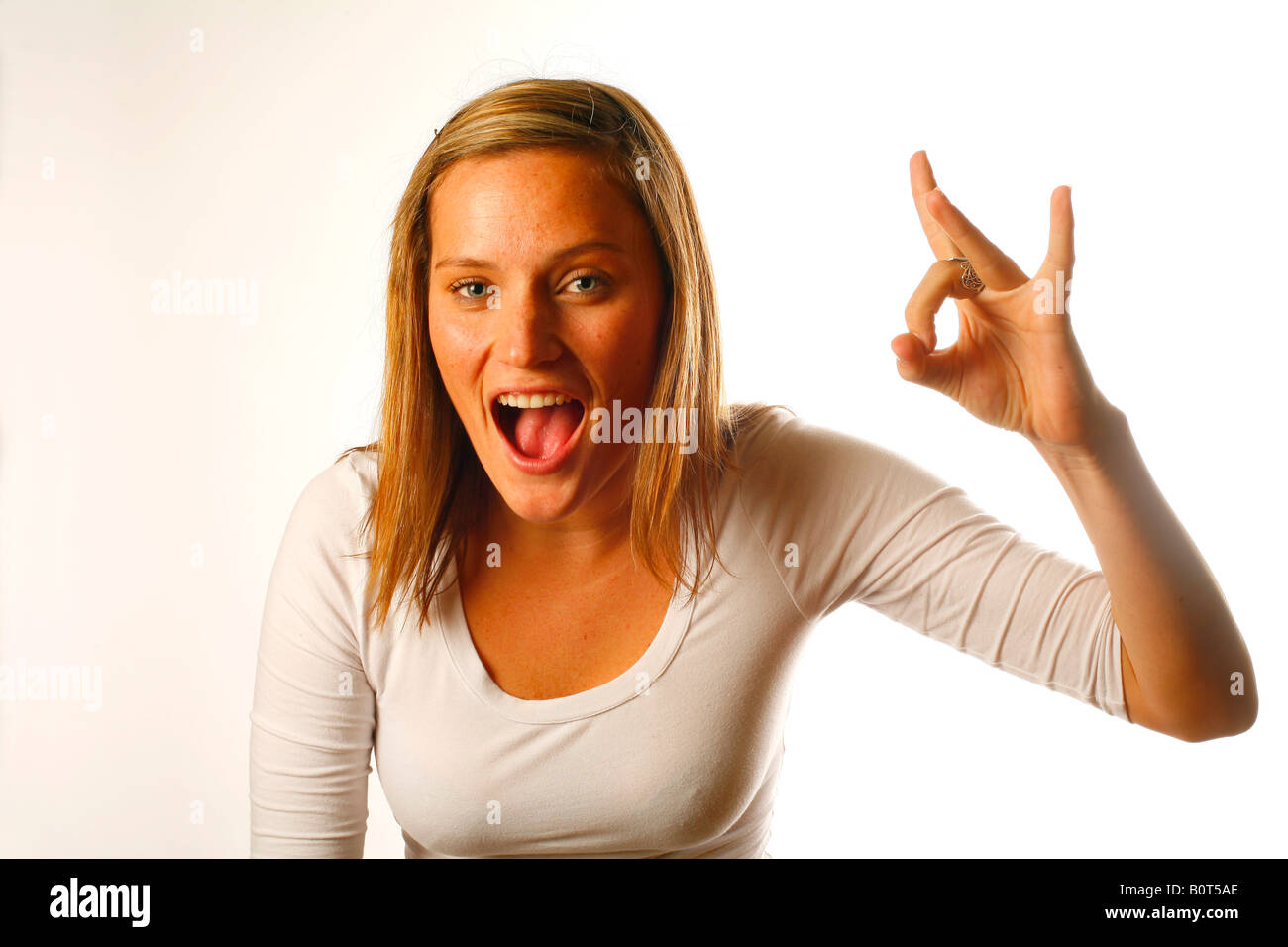 A young woman signals OK Stock Photo - Alamy