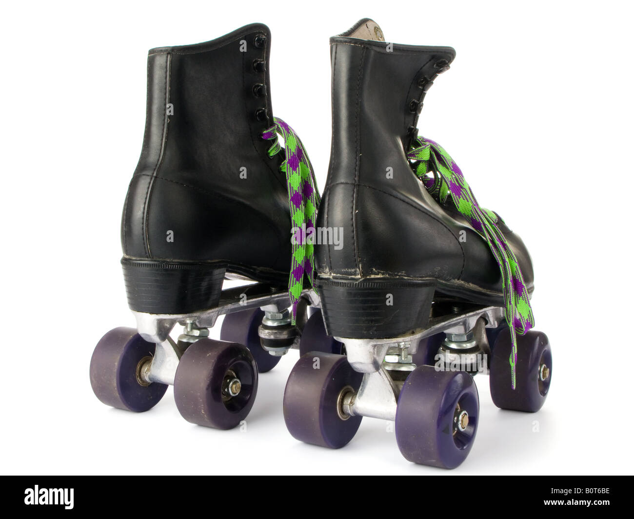 Retro roller skates isolated on white background Stock Photo - Alamy