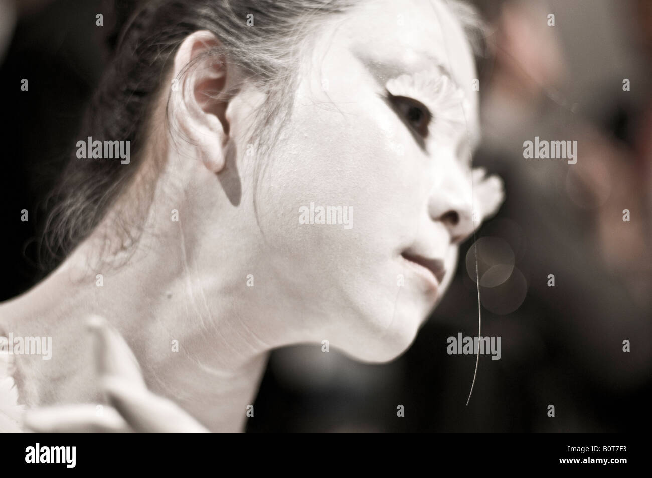 actress performing mimic with white make up and fake eyelush Stock ...