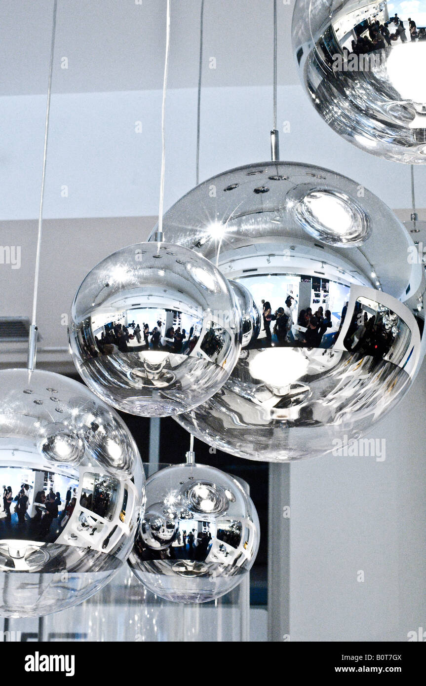 silver balls pending from ceil reflecting the hall Stock Photo - Alamy