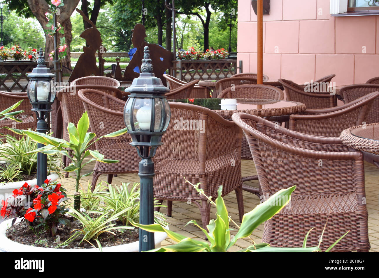 Summer ground in cafe with black metal lantern Stock Photo - Alamy