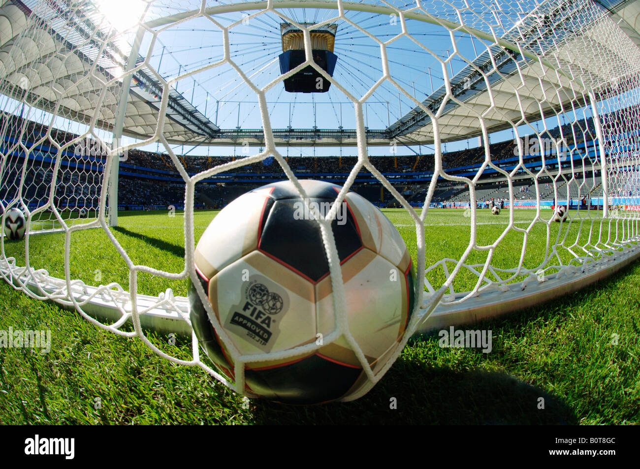 Ball in goal Stock Photo - Alamy