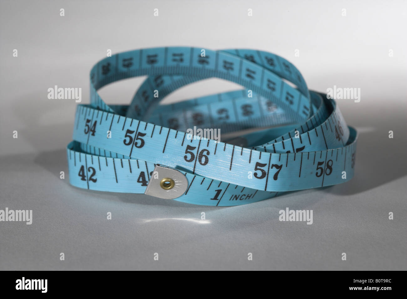 Tape measure coiled up Stock Photo - Alamy