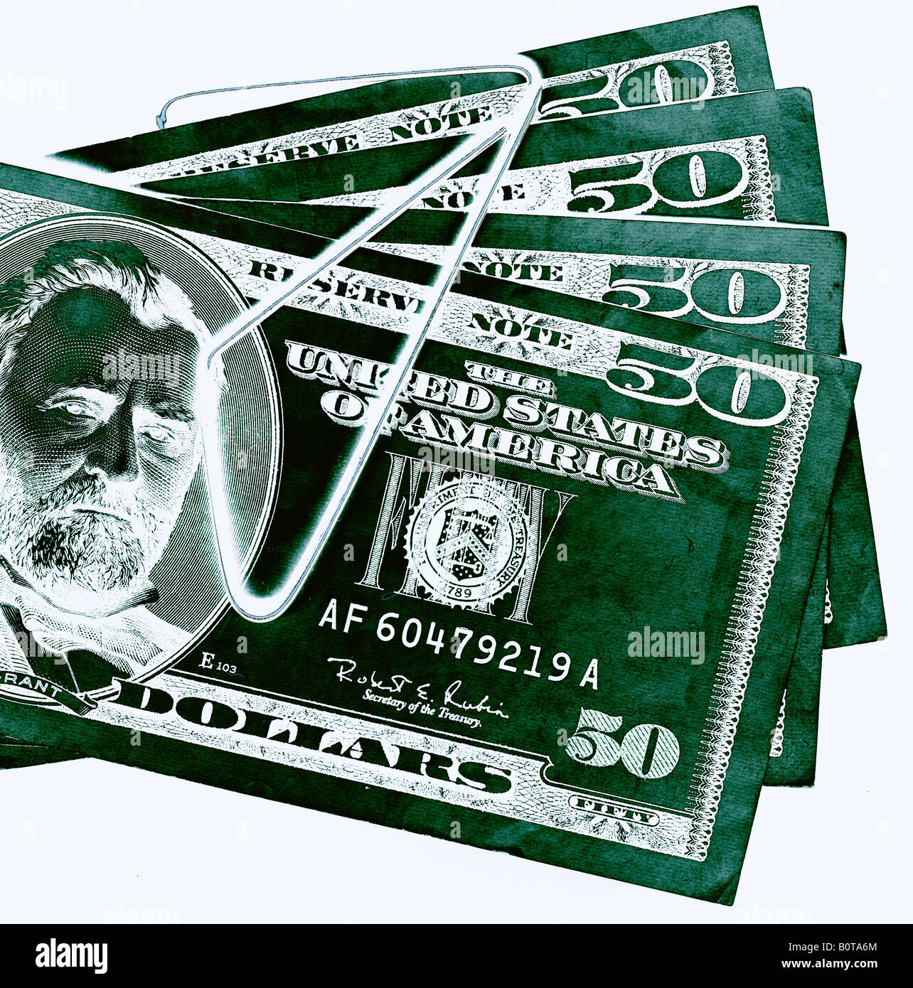 negative conceptual view of several fifty dollar bills US clipped ...