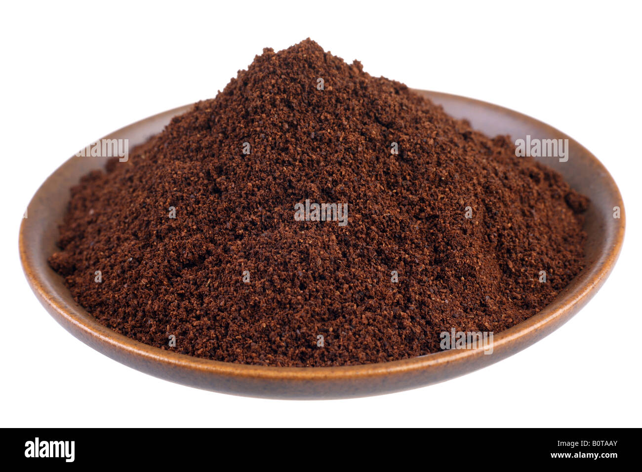 Ground coffe on plate isolated on white background Stock Photo - Alamy