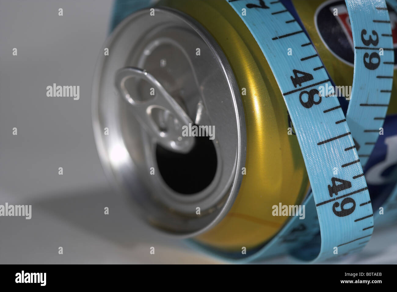 Empty can of beer with tape measure wrapped round it Health and diet ...