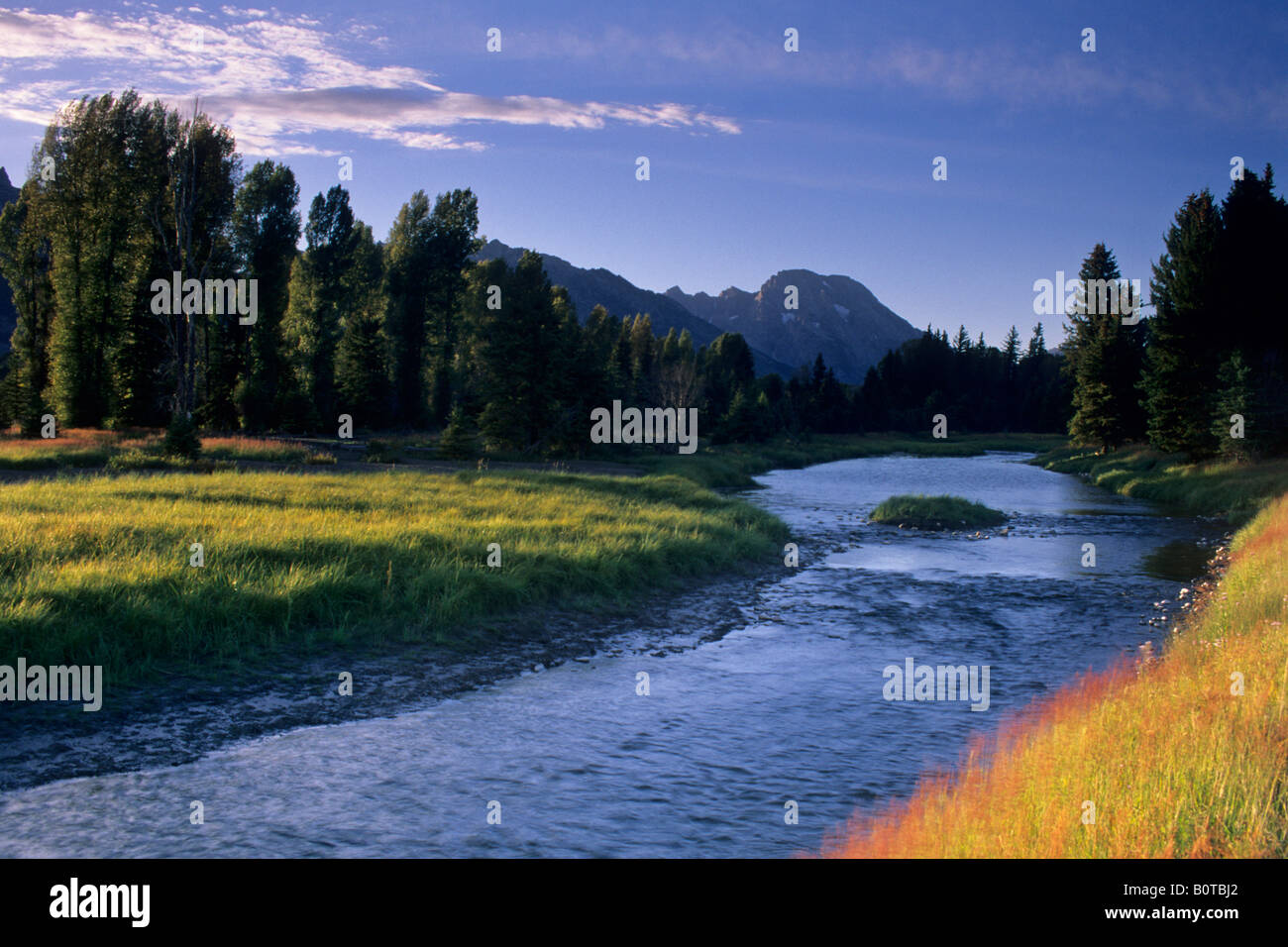 Side channel flow of the Snake River below Mt Moran at sunset Grand ...