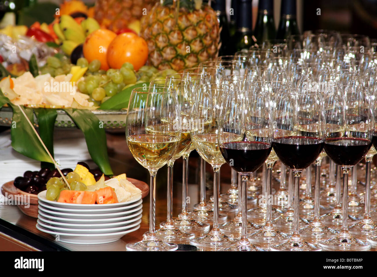Cold table with wine and mixed fruit Stock Photo - Alamy