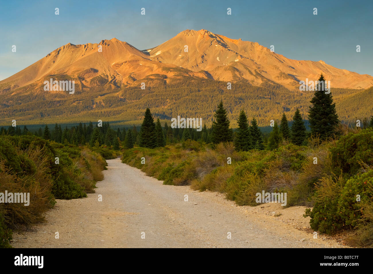 Dirt road below Mount Shasta Volcano at sunset Cascade Range Siskiyou ...