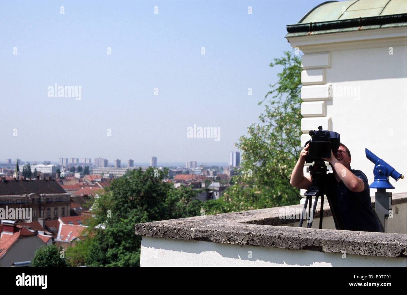 Man with TV camera and cityscape Zagreb Croatia Stock Photo - Alamy