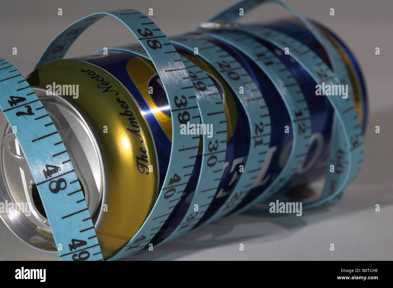 Empty can of beer with tape measure wrapped round it Health and diet ...