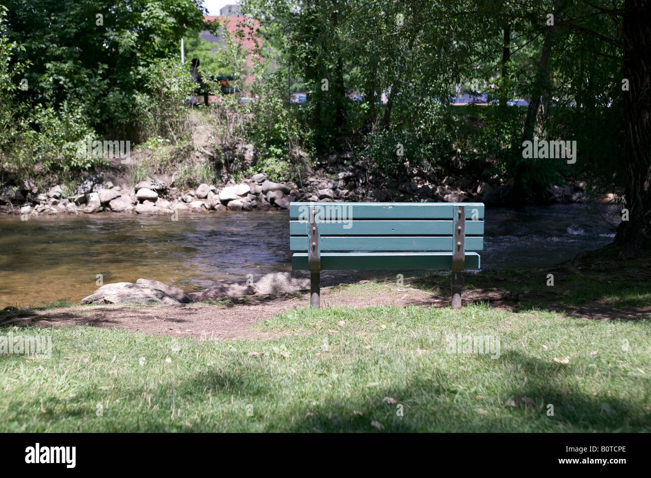 Bench along river side Boulder Colorado Stock Photo - Alamy