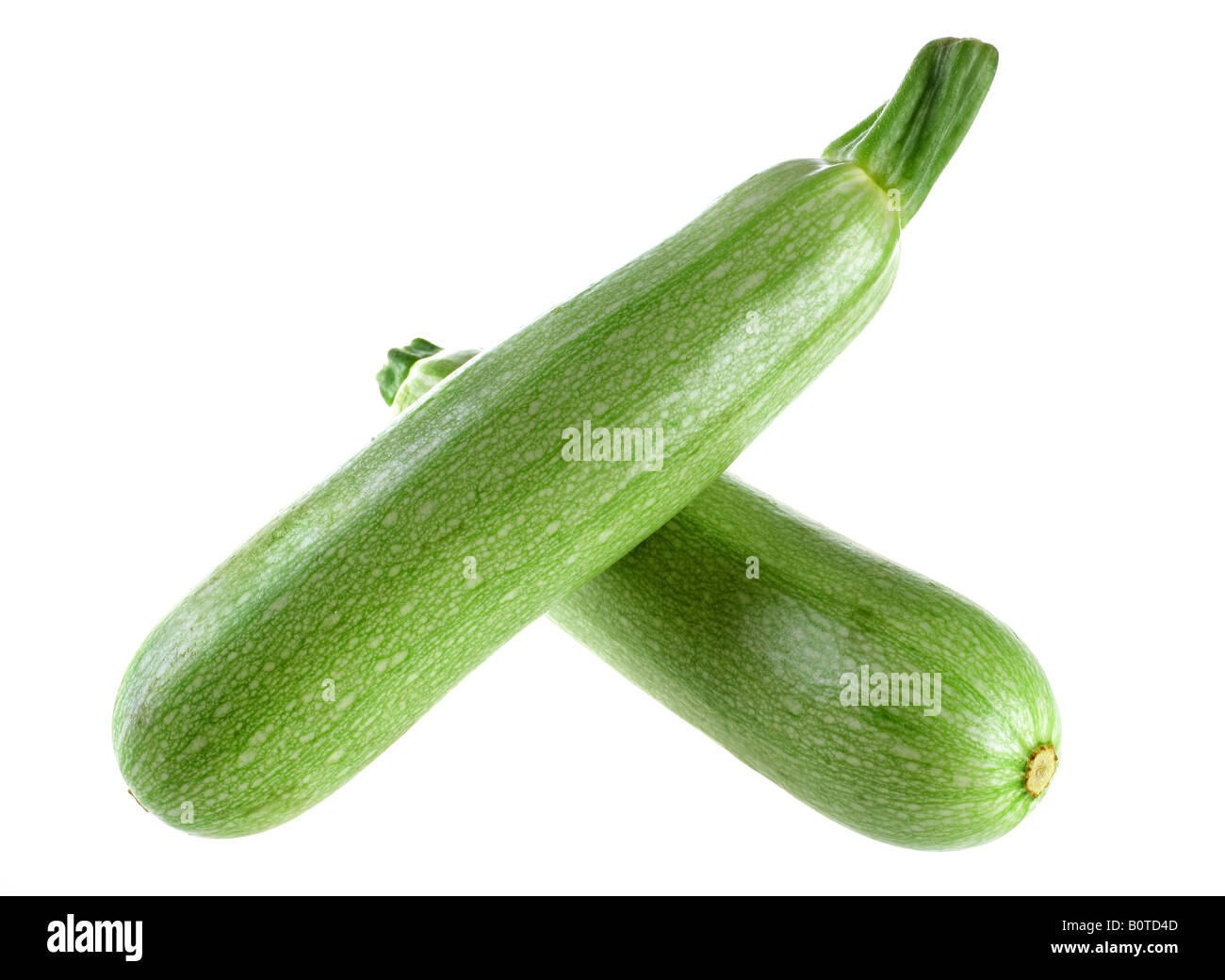 Green zucchini vegetable isolated on white background Stock Photo - Alamy